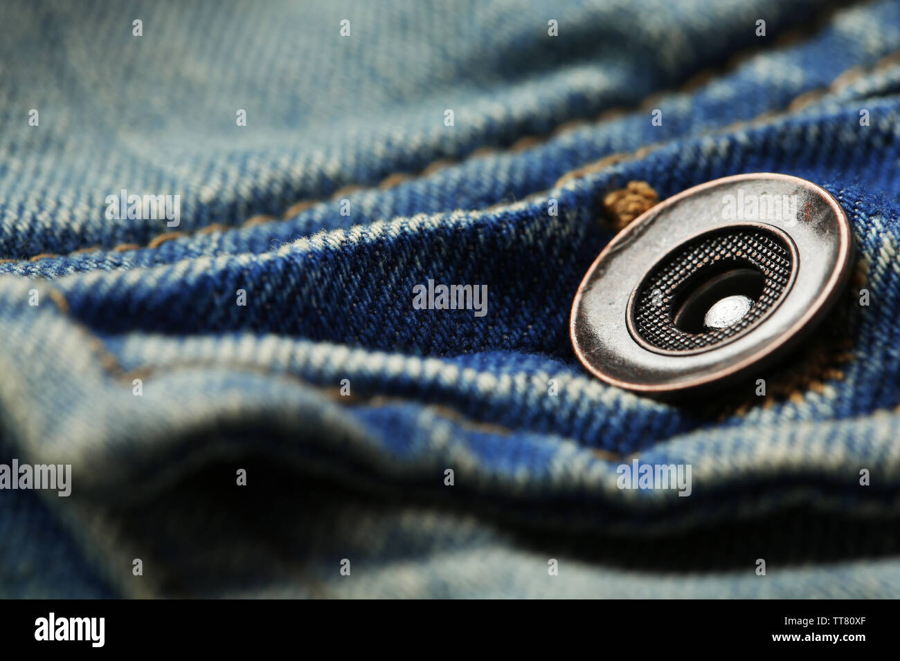 Metal button on clothes close up Stock Photo - Alamy