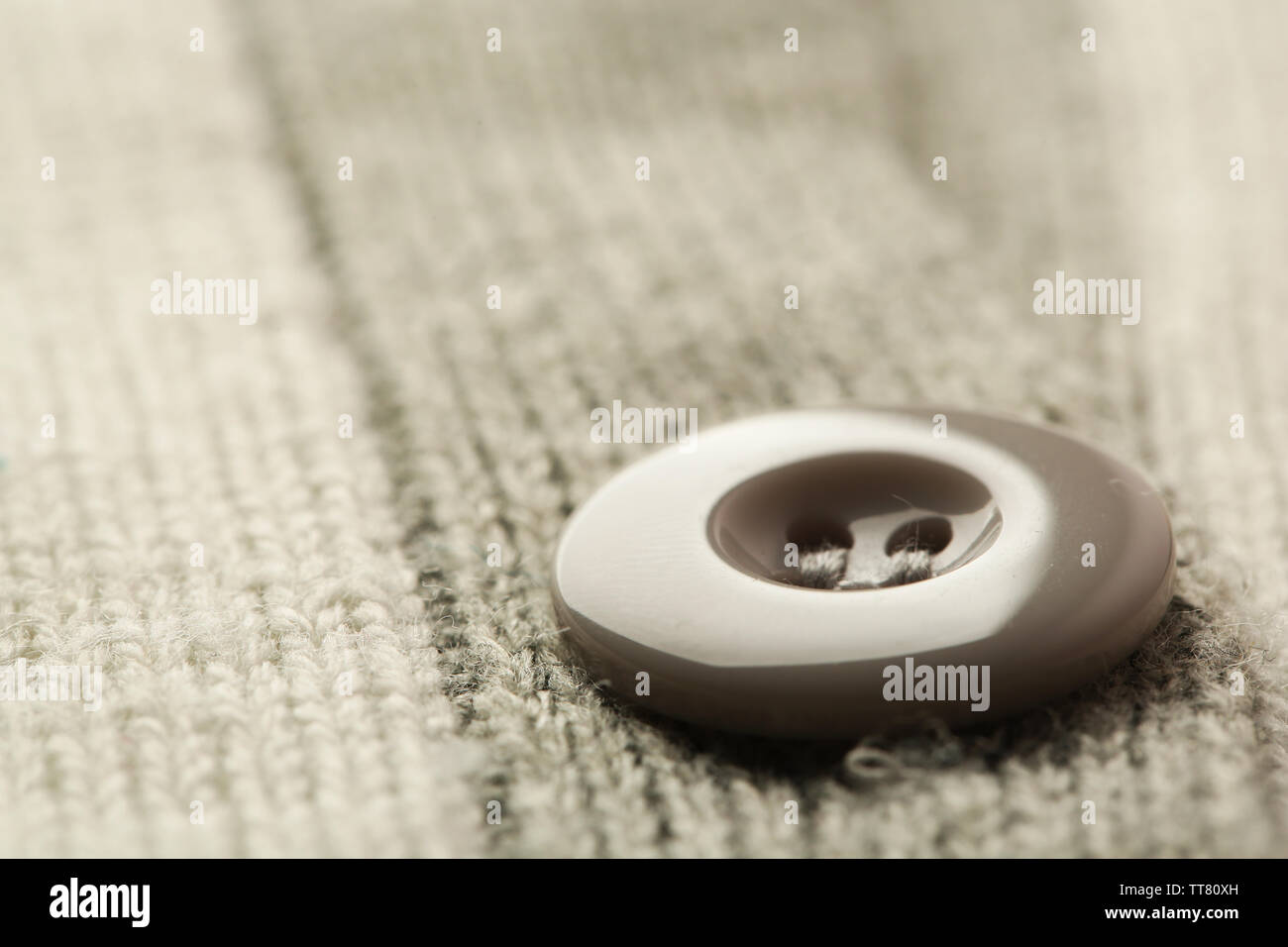 Button on clothes close up Stock Photo - Alamy