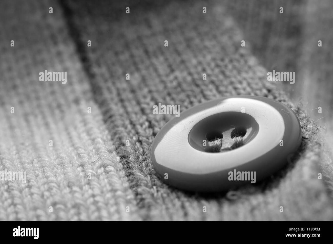 Button on clothes close up Stock Photo - Alamy