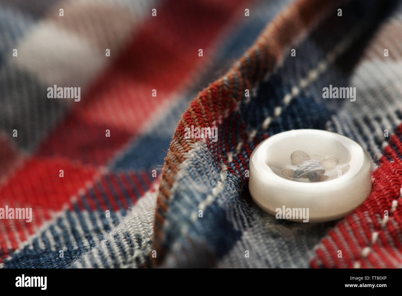 Button on clothes close up Stock Photo - Alamy