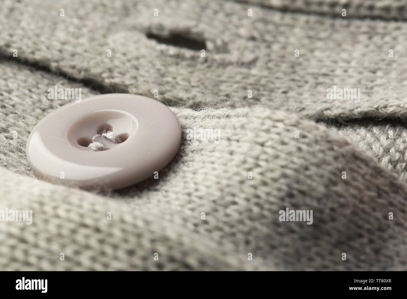 Button on clothes close up Stock Photo - Alamy