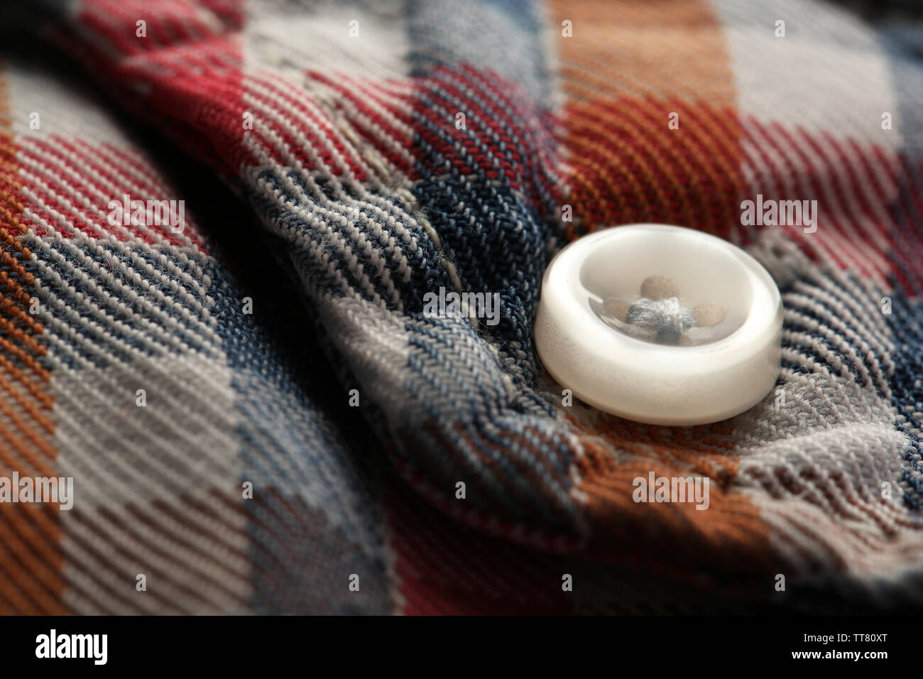 Button on clothes close up Stock Photo - Alamy