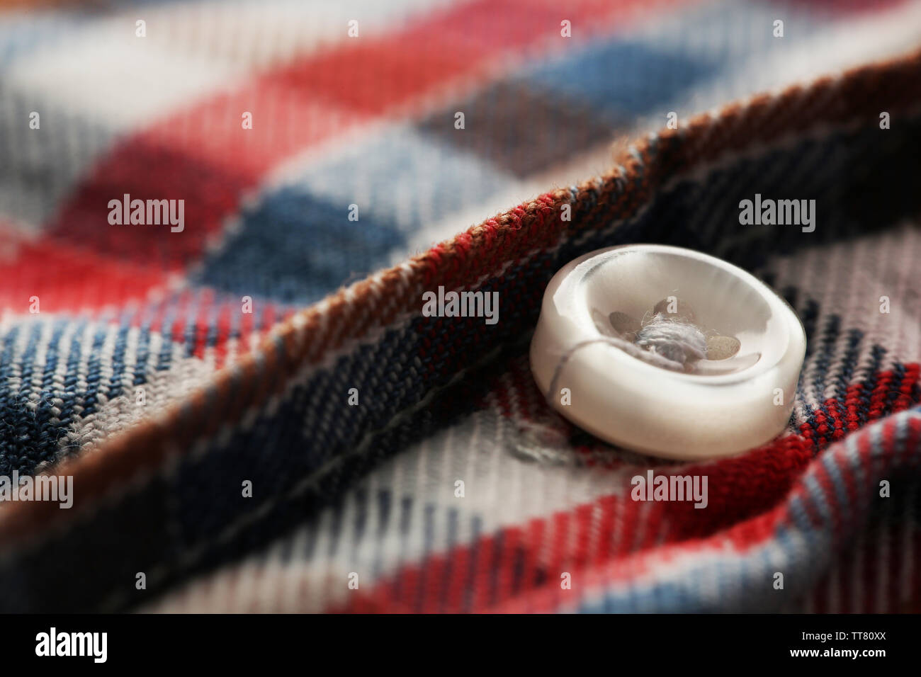 Button on clothes close up Stock Photo - Alamy