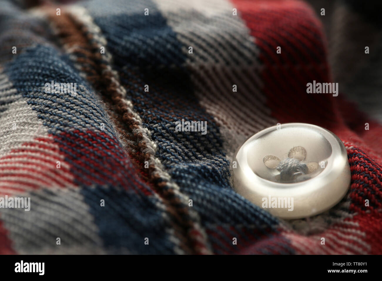 Button on clothes close up Stock Photo - Alamy