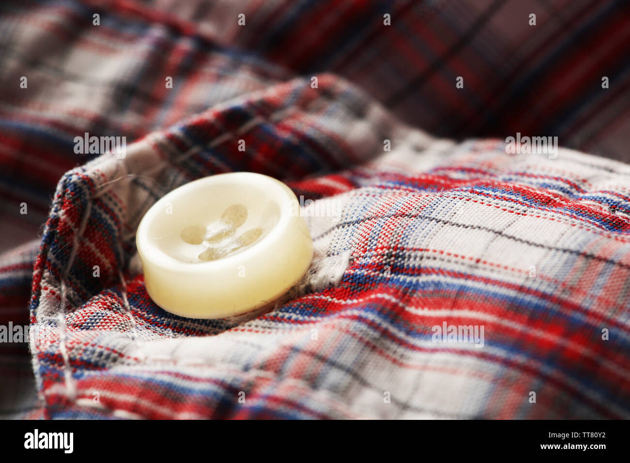 Button on clothes close up Stock Photo - Alamy