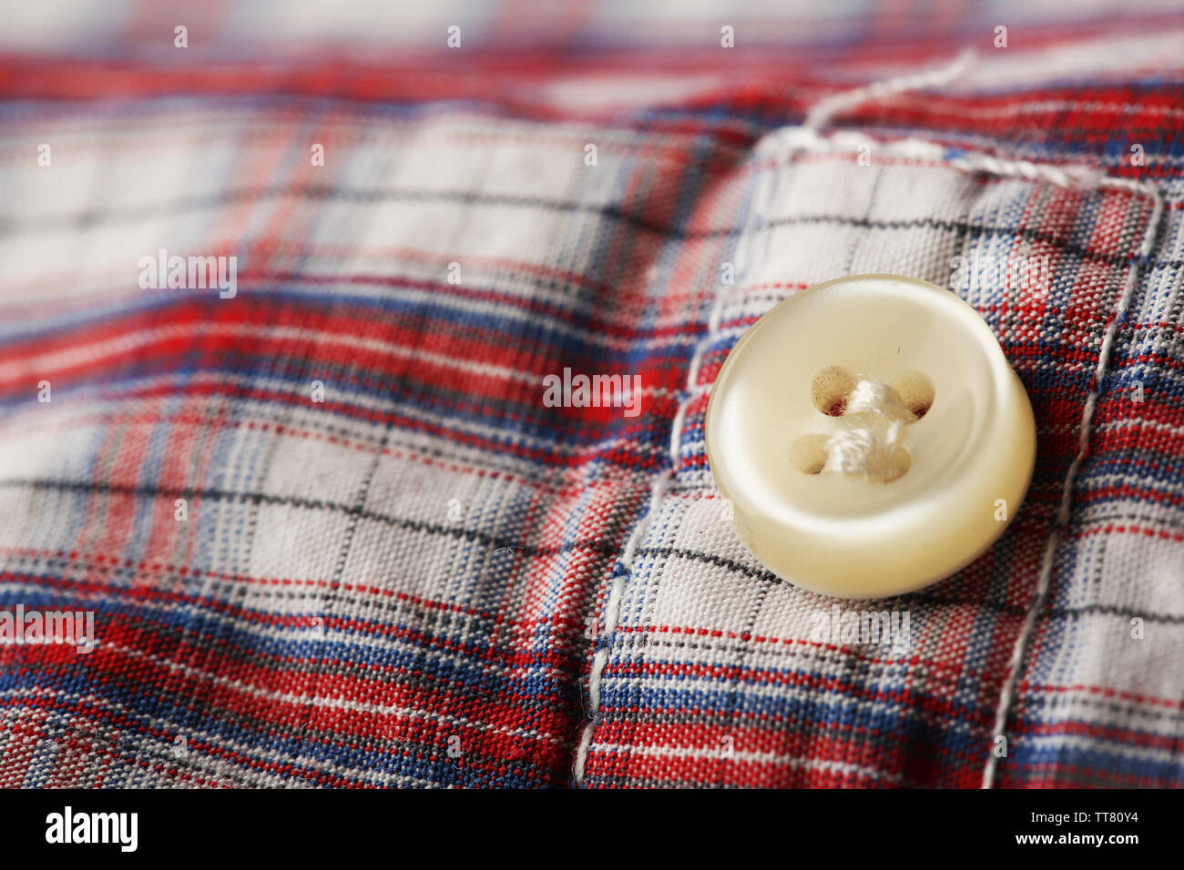 Button on clothes close up Stock Photo - Alamy