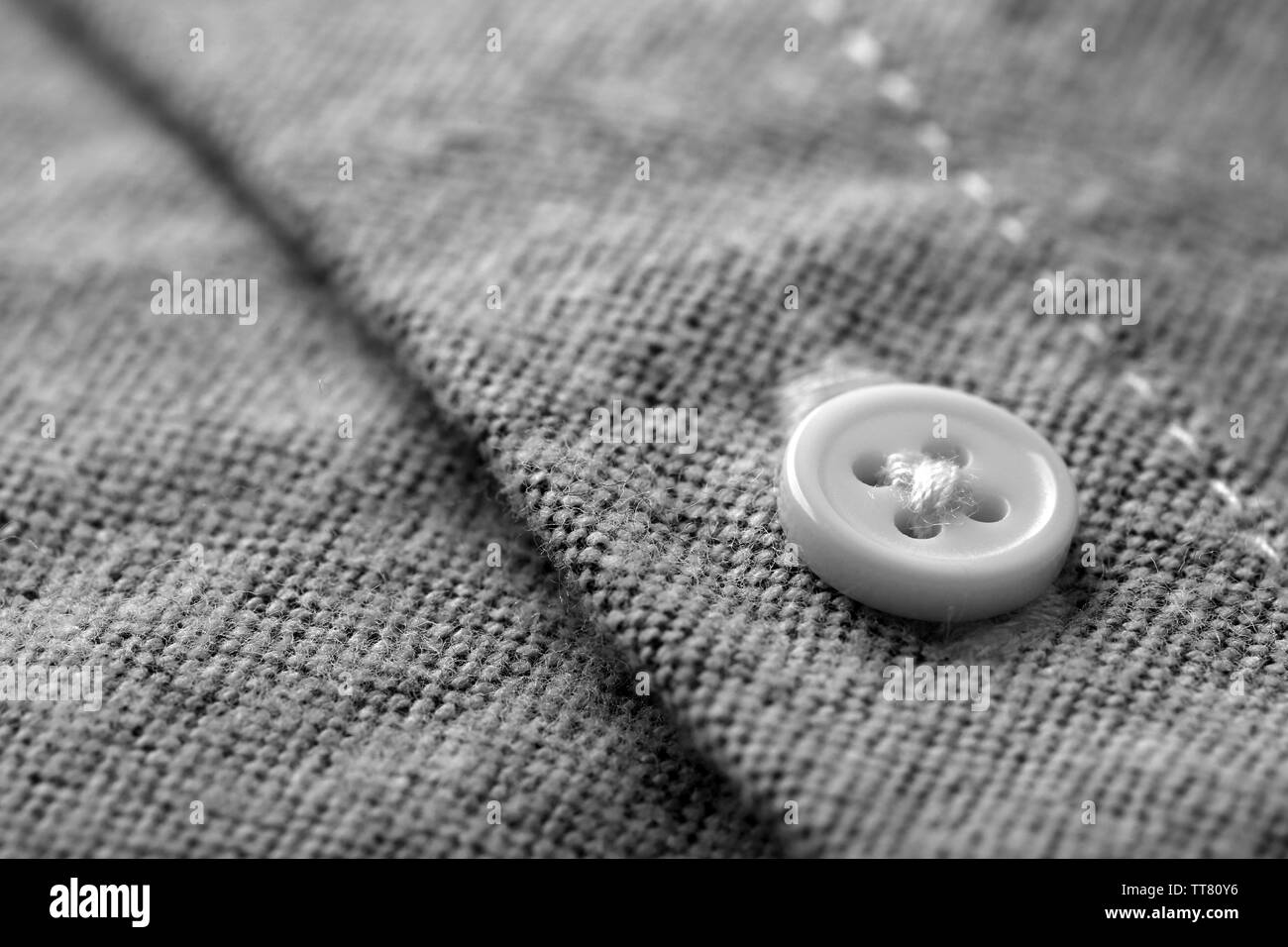 Button on clothes close up Stock Photo - Alamy