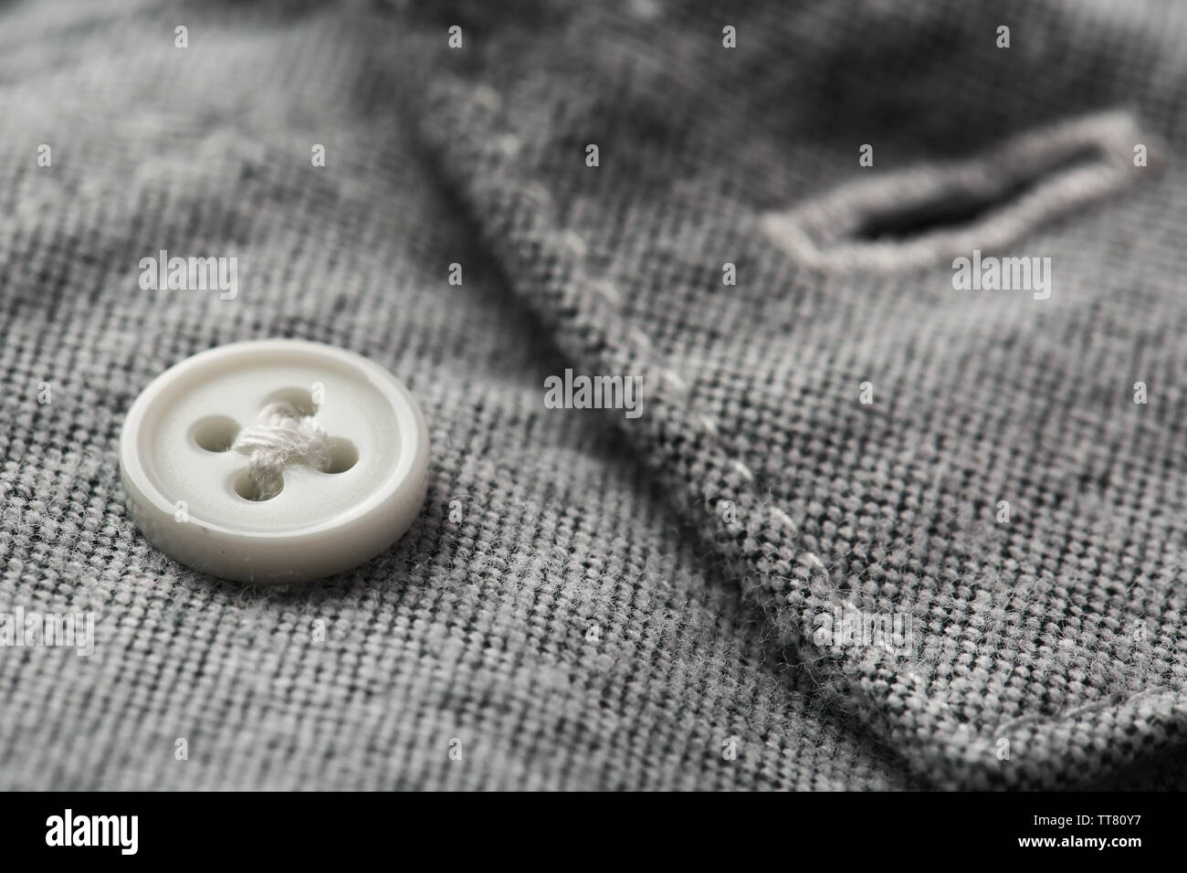 Button on clothes close up Stock Photo - Alamy