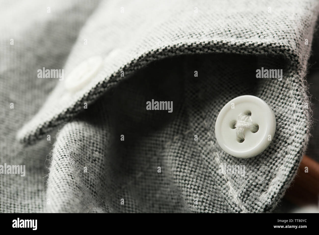 Button on clothes close up Stock Photo - Alamy