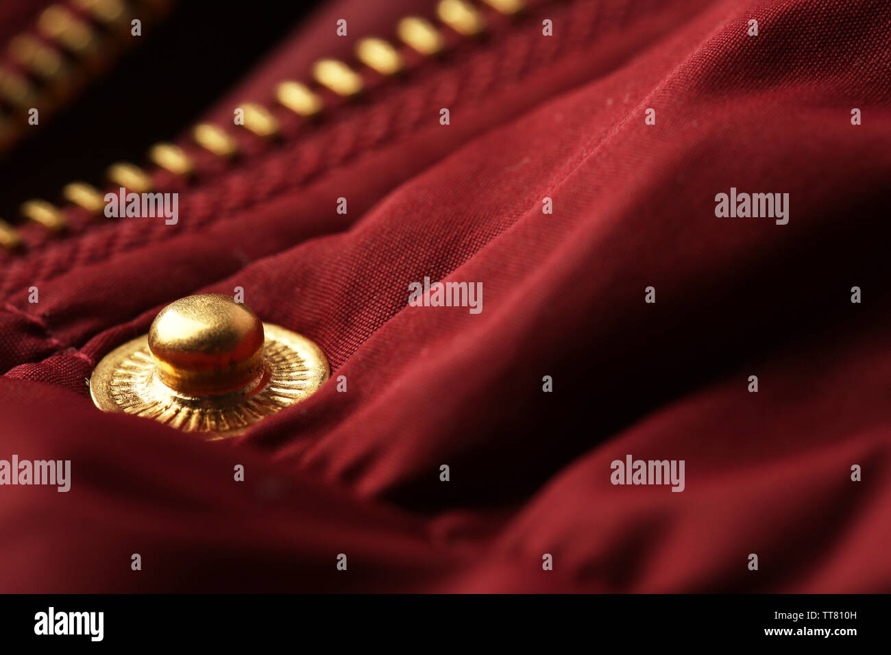Metal button on clothes close up Stock Photo - Alamy