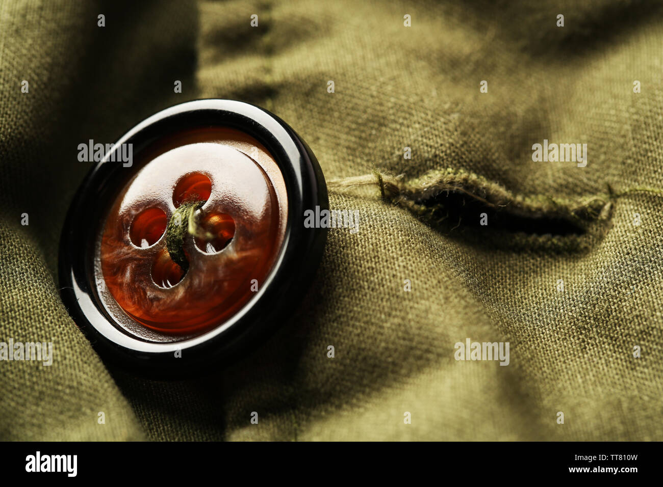 Button on clothes close up Stock Photo - Alamy