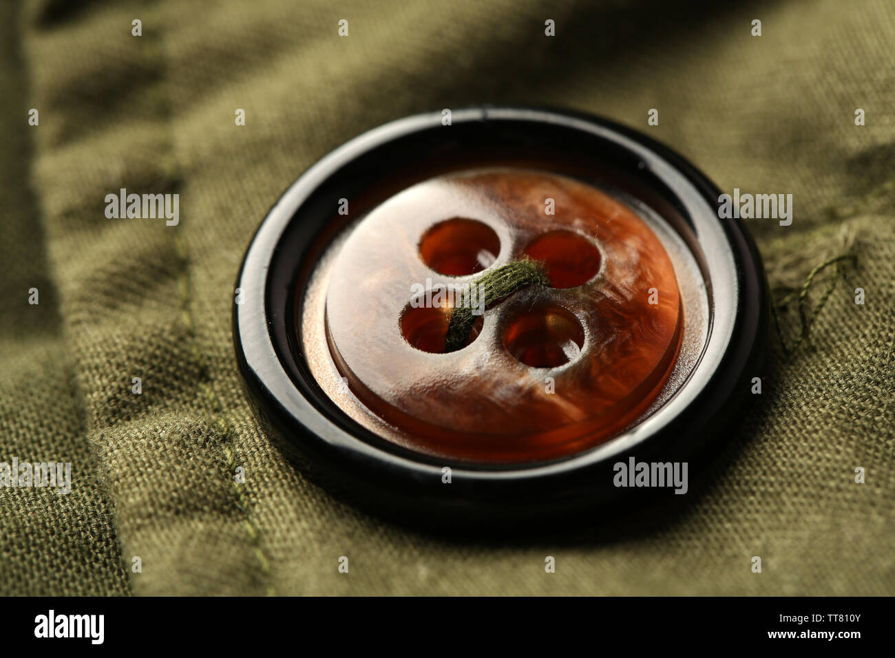 Button on clothes close up Stock Photo - Alamy