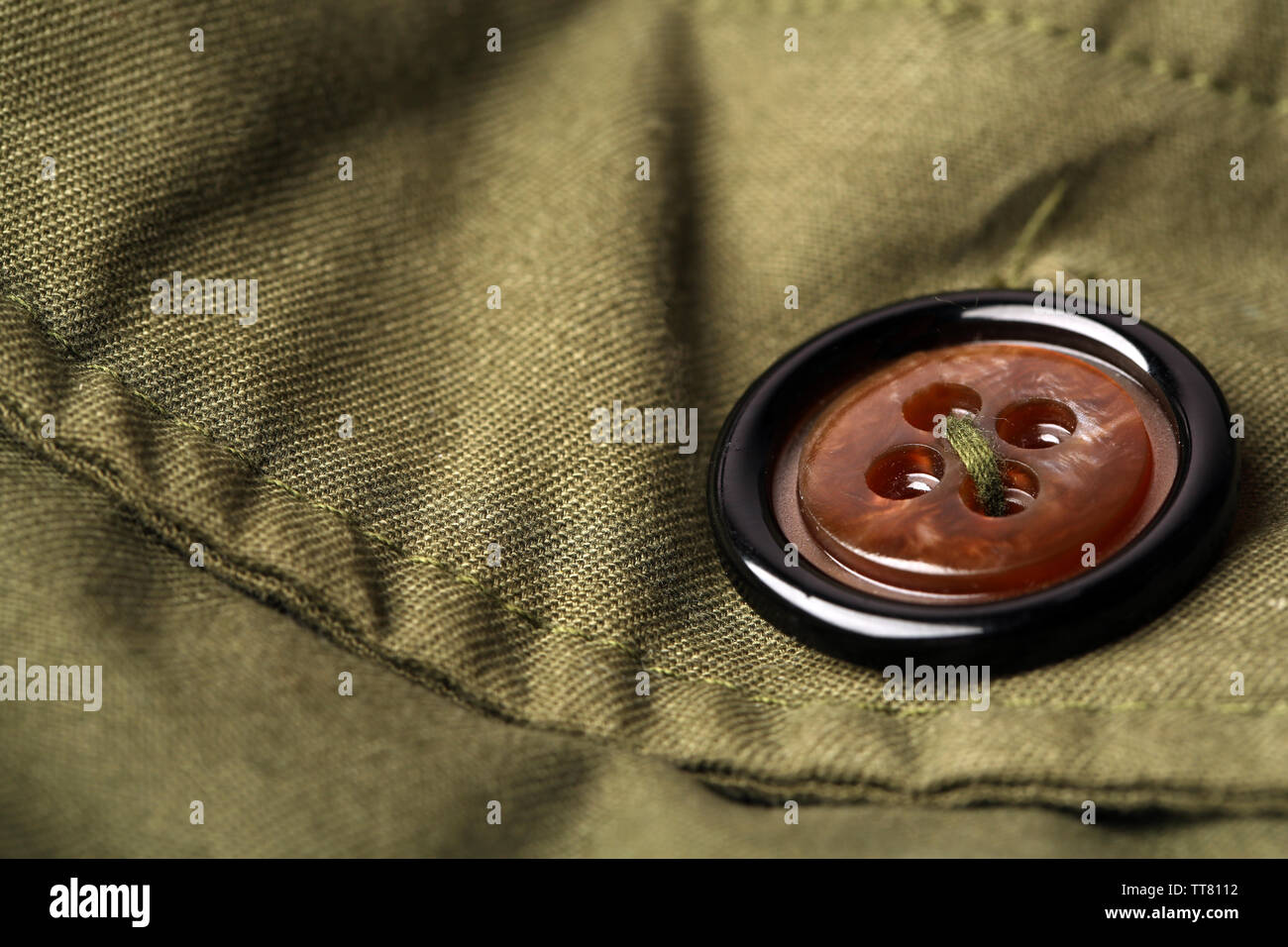 Button on clothes close up Stock Photo - Alamy