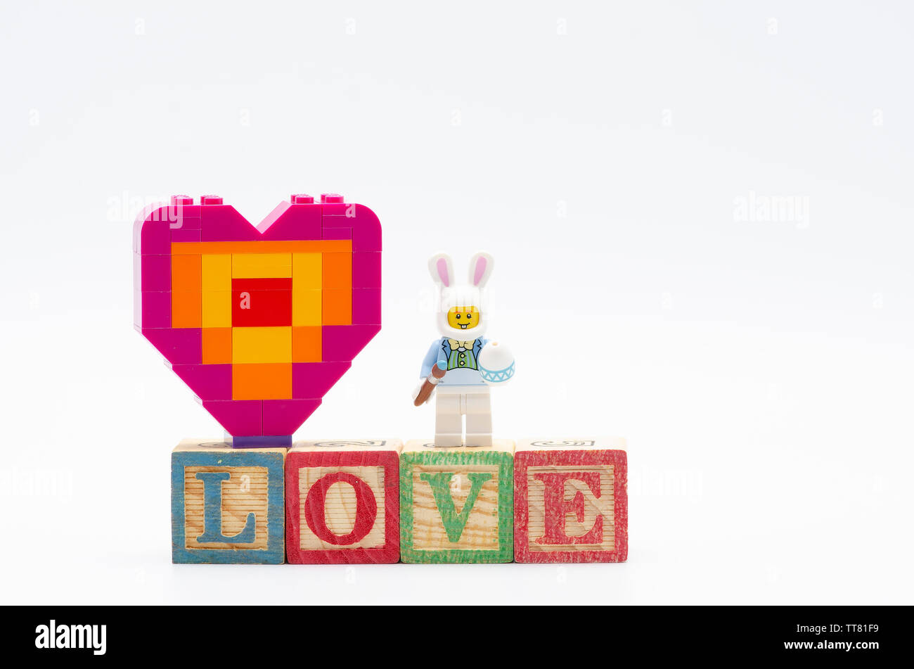 lego bunny suit guy with easter egg and piece offering heart shape ...