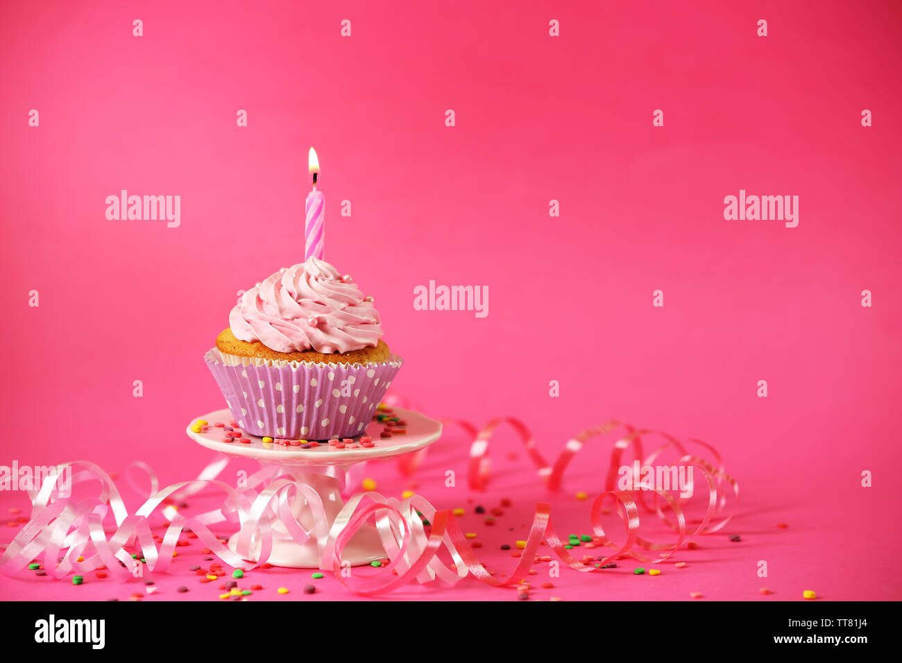 Delicious cupcake on table on pink background Stock Photo - Alamy