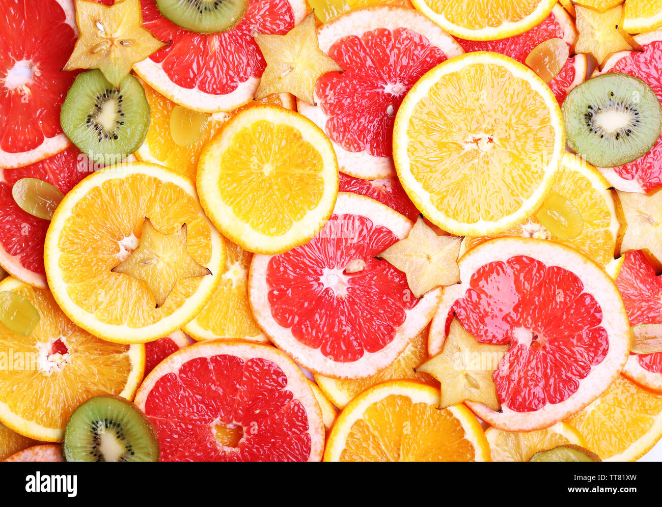 Sliced fruits background Stock Photo - Alamy