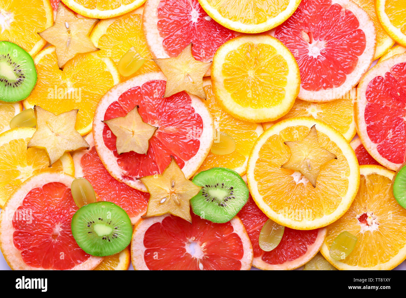 Sliced fruits background Stock Photo - Alamy