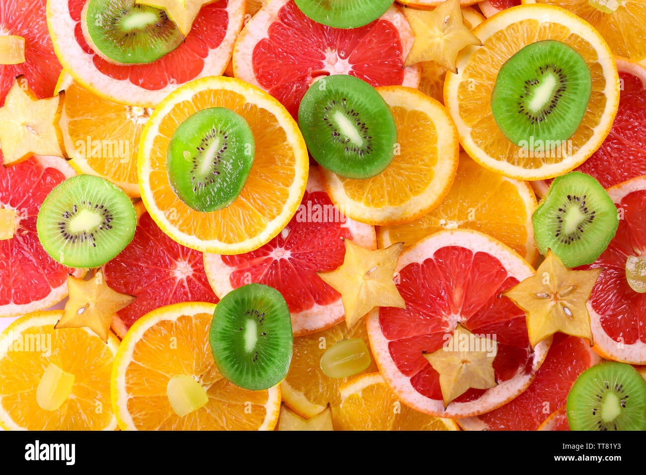 Sliced fruits background Stock Photo - Alamy