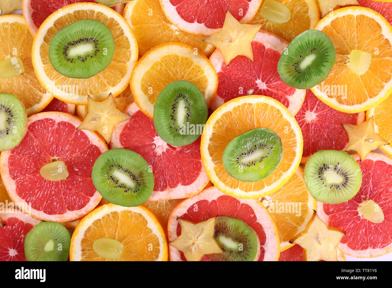 Sliced fruits background Stock Photo - Alamy