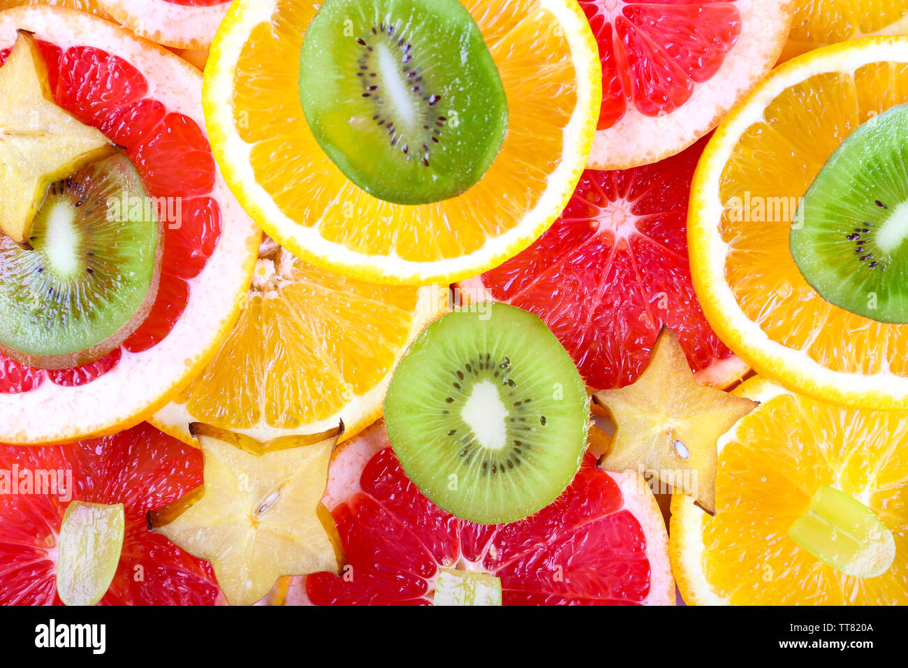 Sliced fruits background Stock Photo - Alamy
