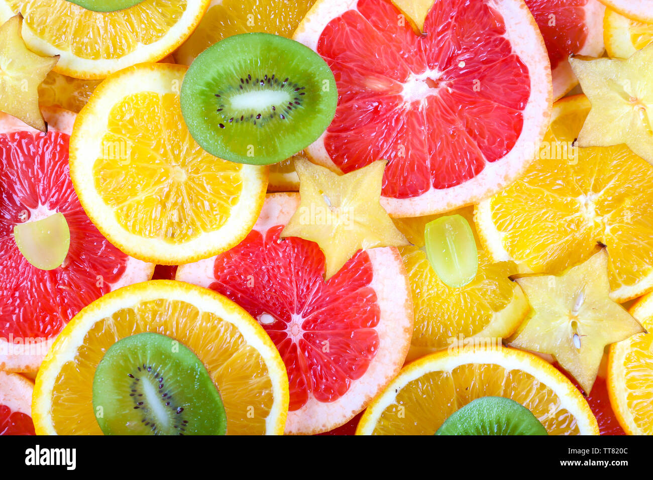 Sliced fruits background Stock Photo - Alamy