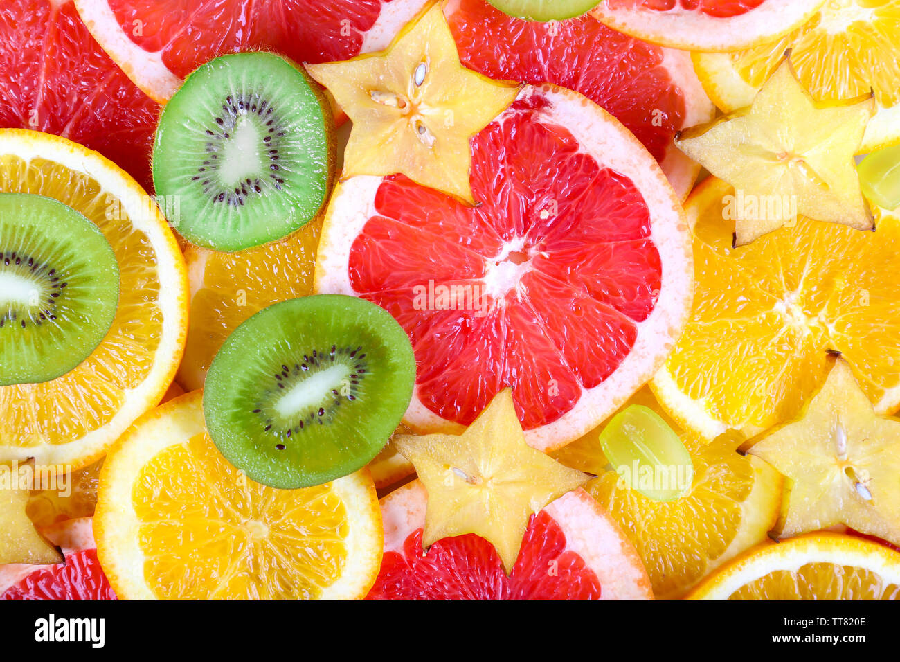 Sliced fruits background Stock Photo - Alamy