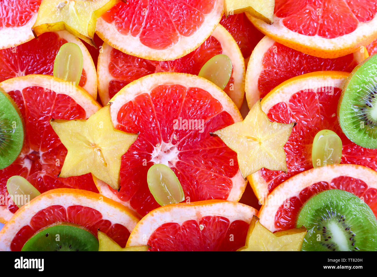 Sliced fruits background Stock Photo - Alamy