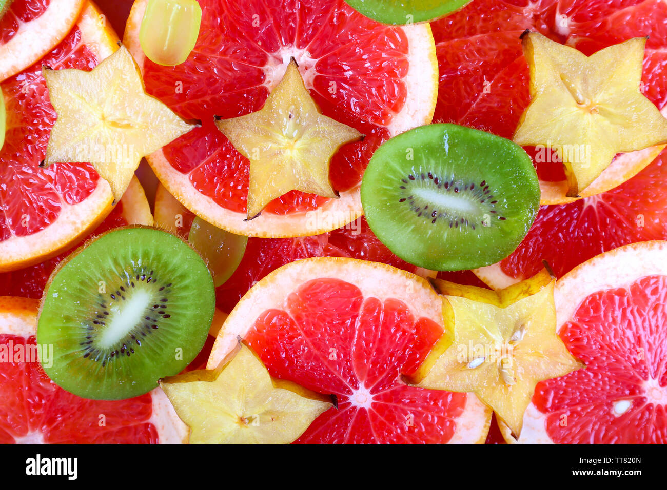 Sliced fruits background Stock Photo - Alamy