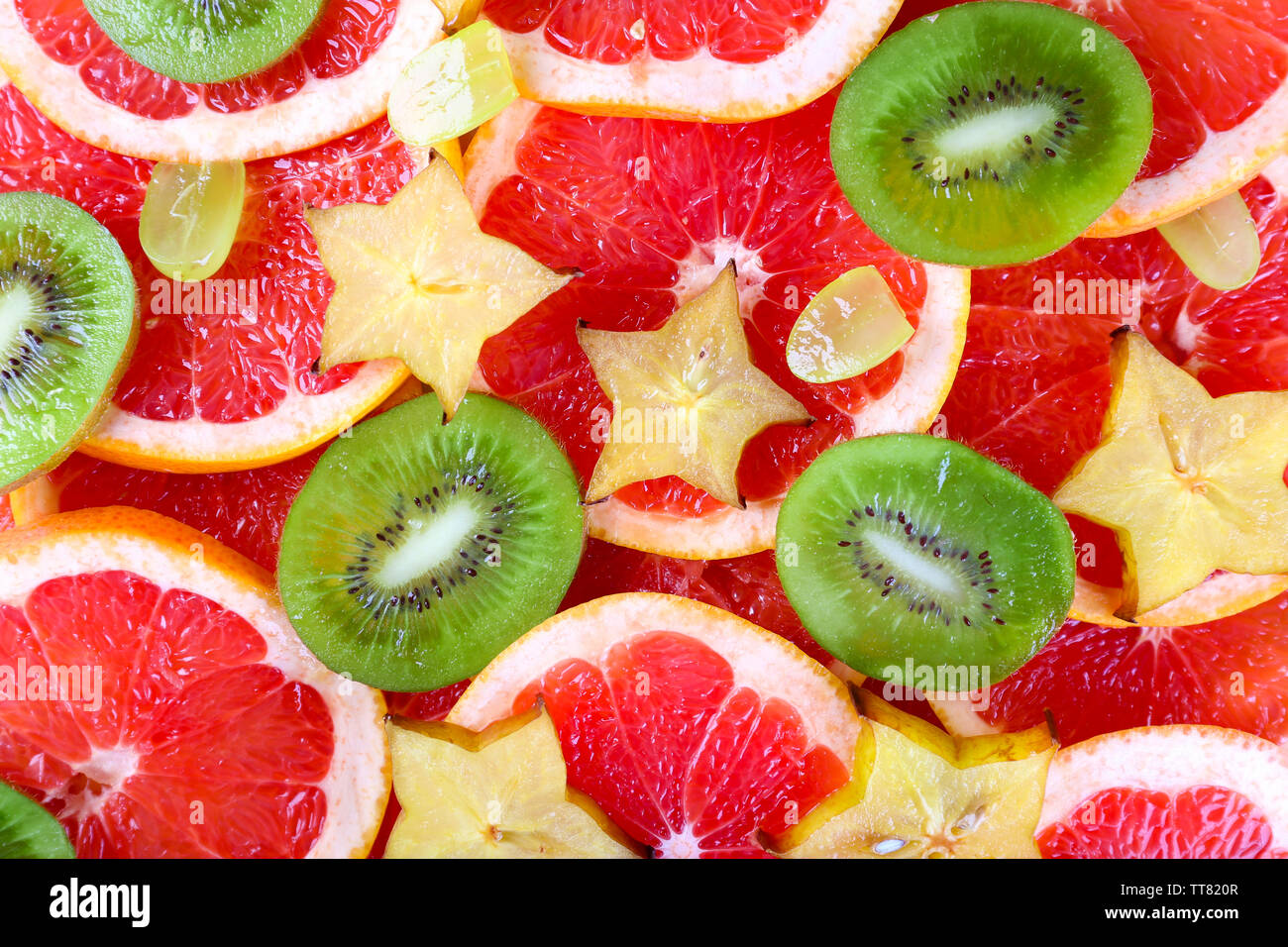 Sliced fruits background Stock Photo - Alamy