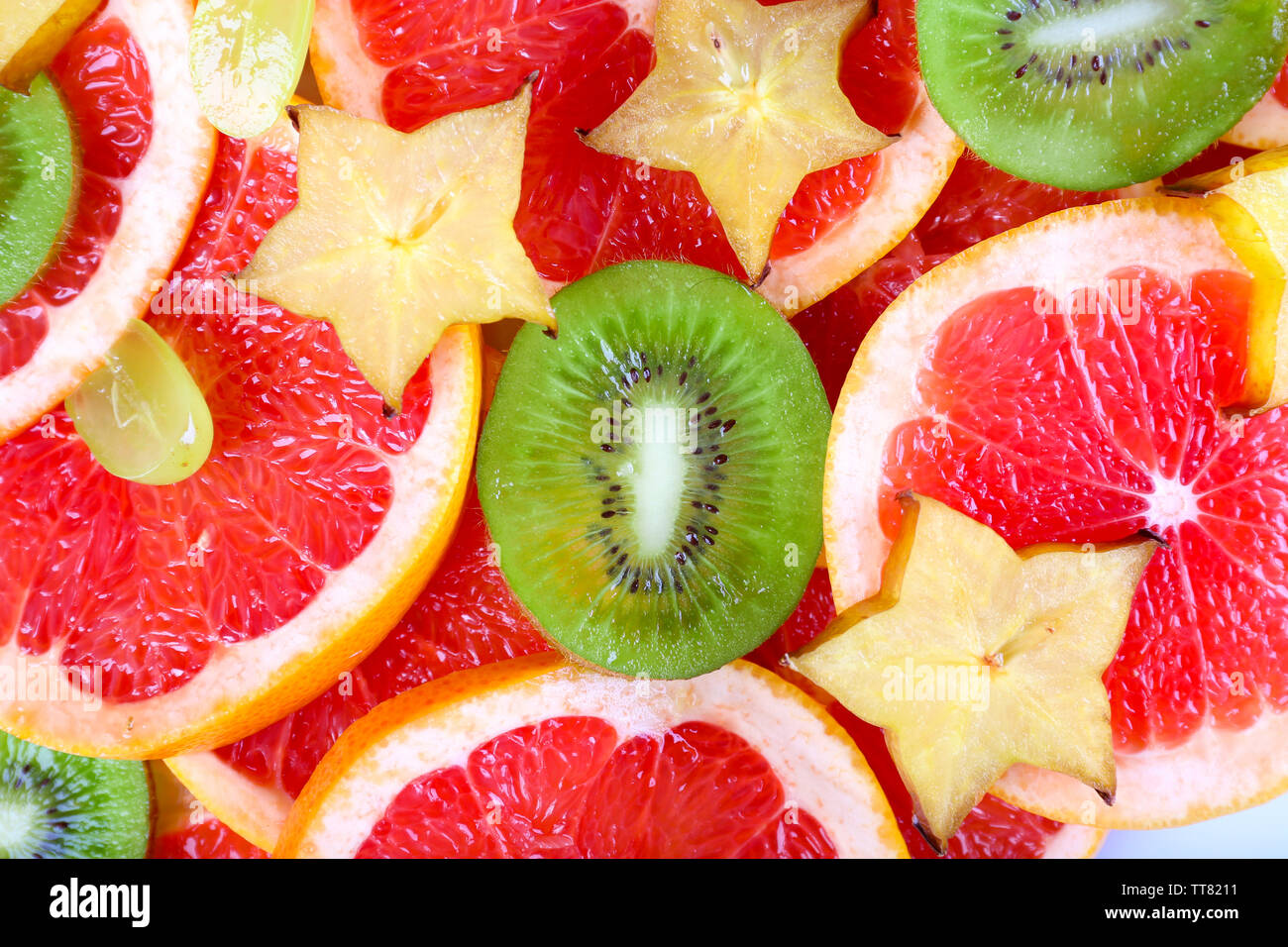 Sliced fruits background Stock Photo - Alamy