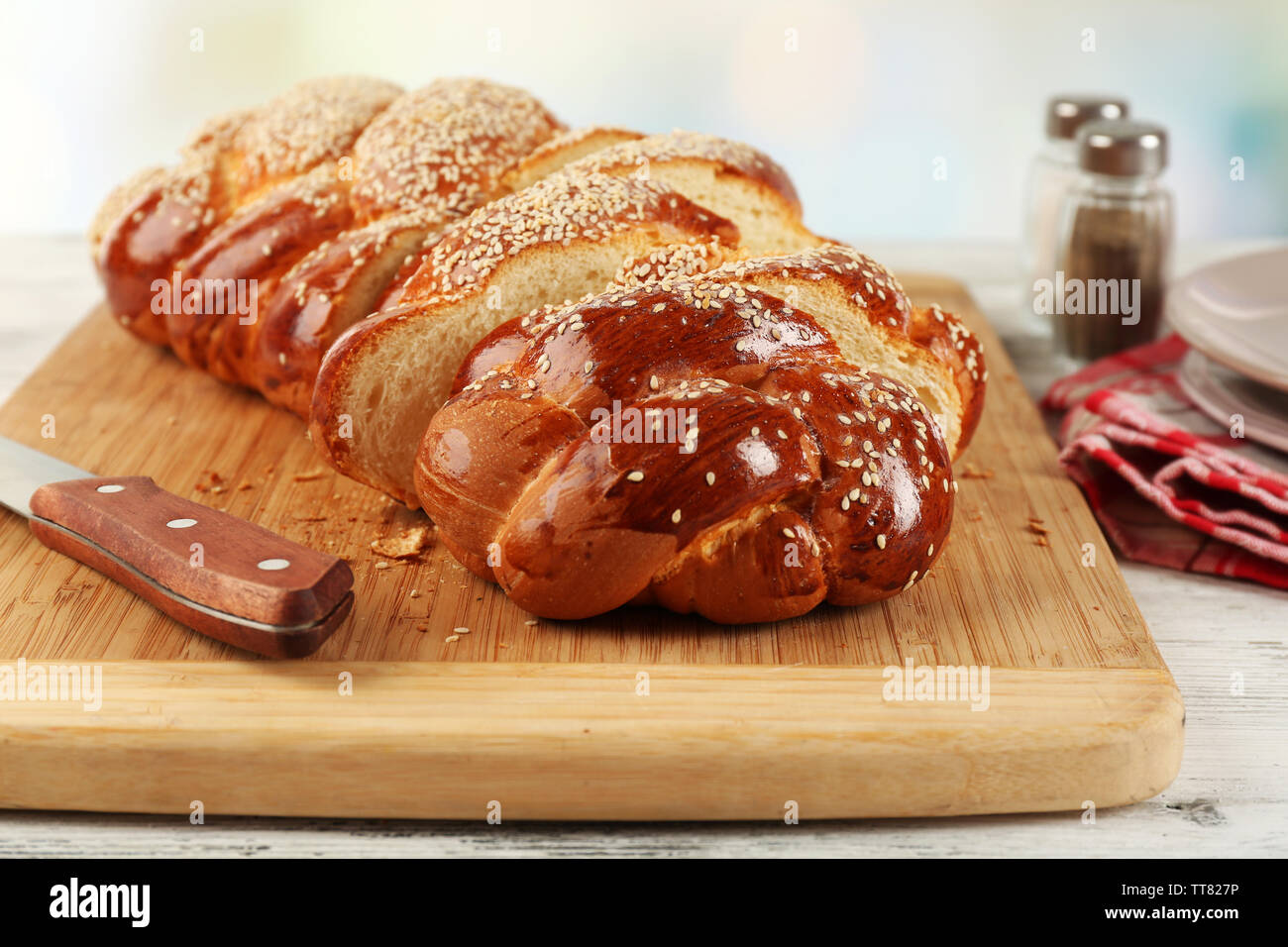 Sliced fresh bun on cutting board on bright background Stock Photo - Alamy