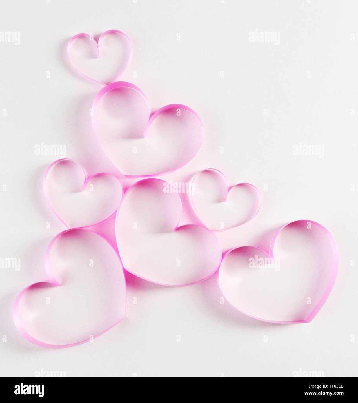 Pink paper hearts isolated on white Stock Photo - Alamy