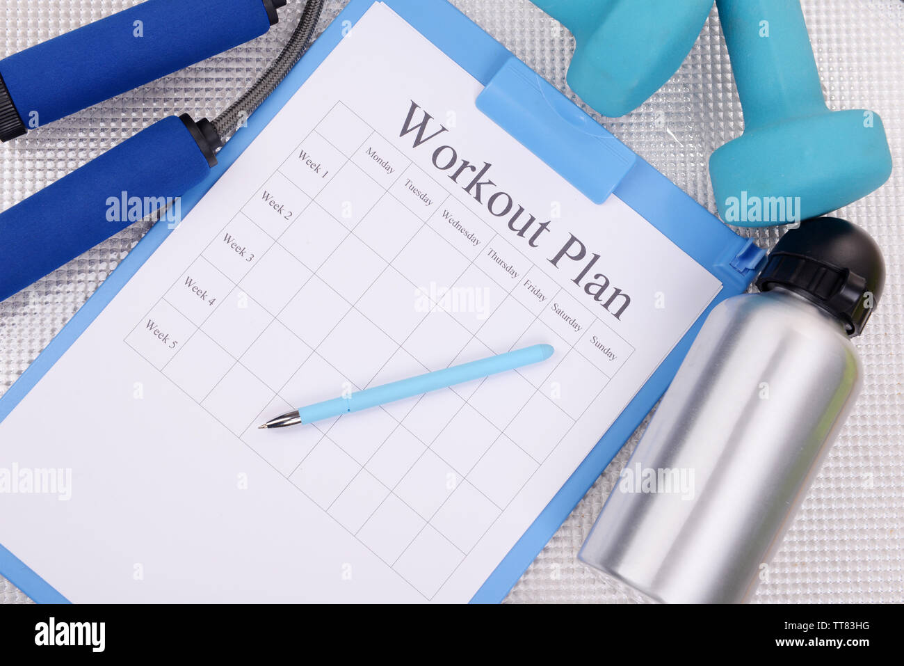 Workout plan and sports equipment top view close-up Stock Photo - Alamy
