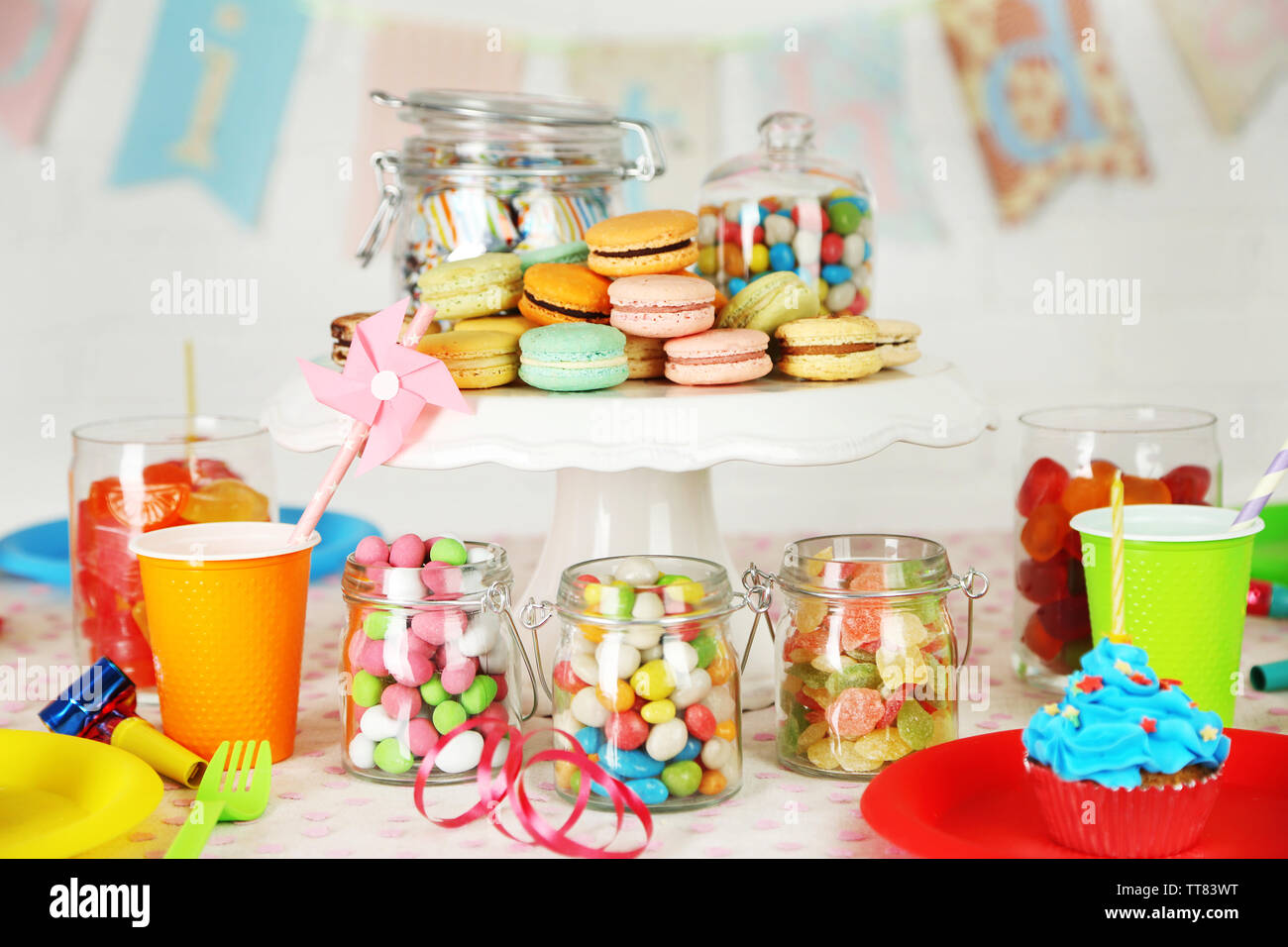 Prepared birthday table with sweets for children party Stock Photo - Alamy