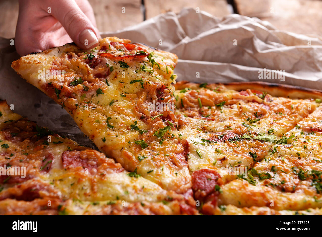 Hand pizza slice close up hi-res stock photography and images - Alamy