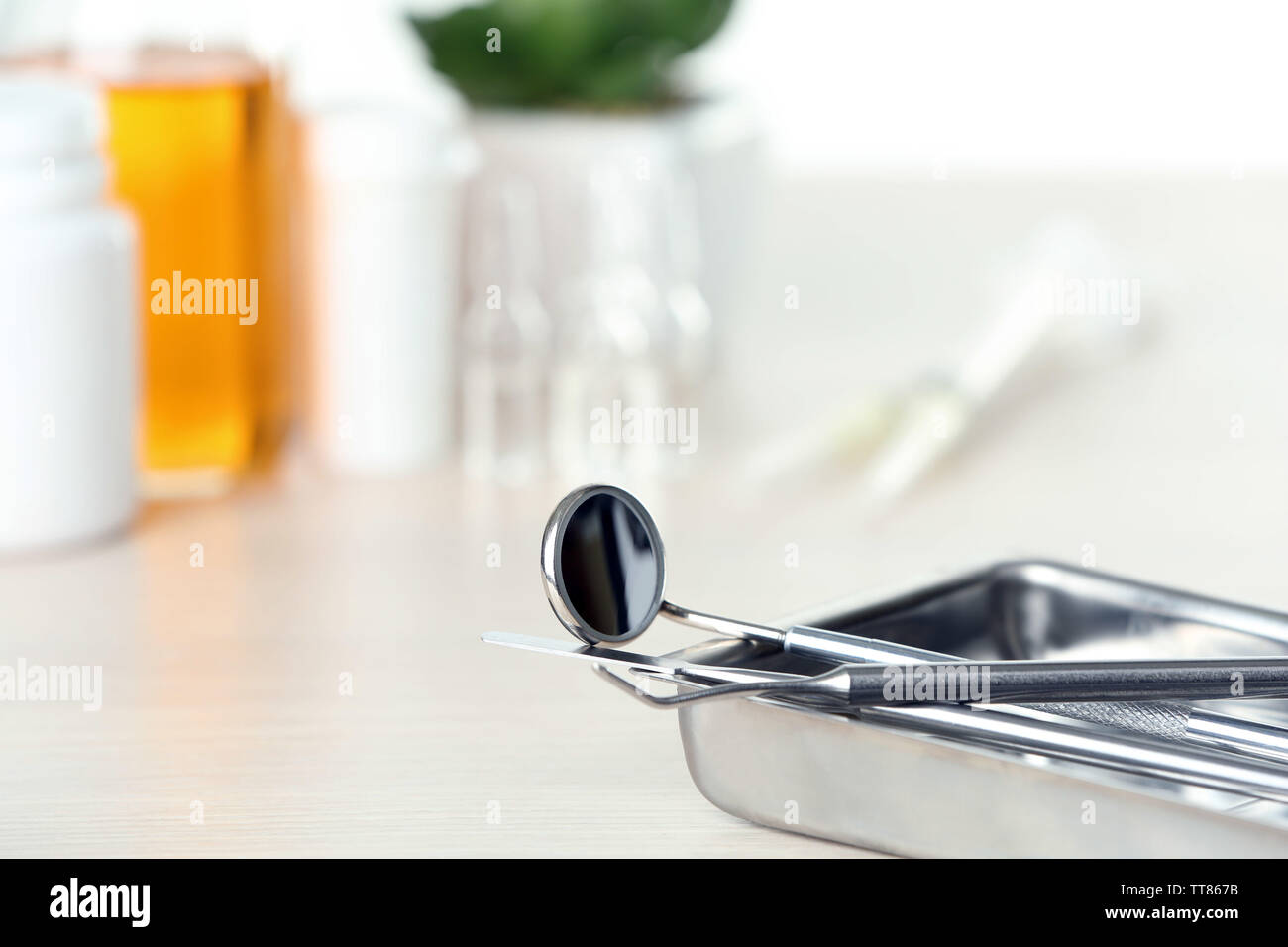Dentist tools in metal tray on table close up Stock Photo - Alamy