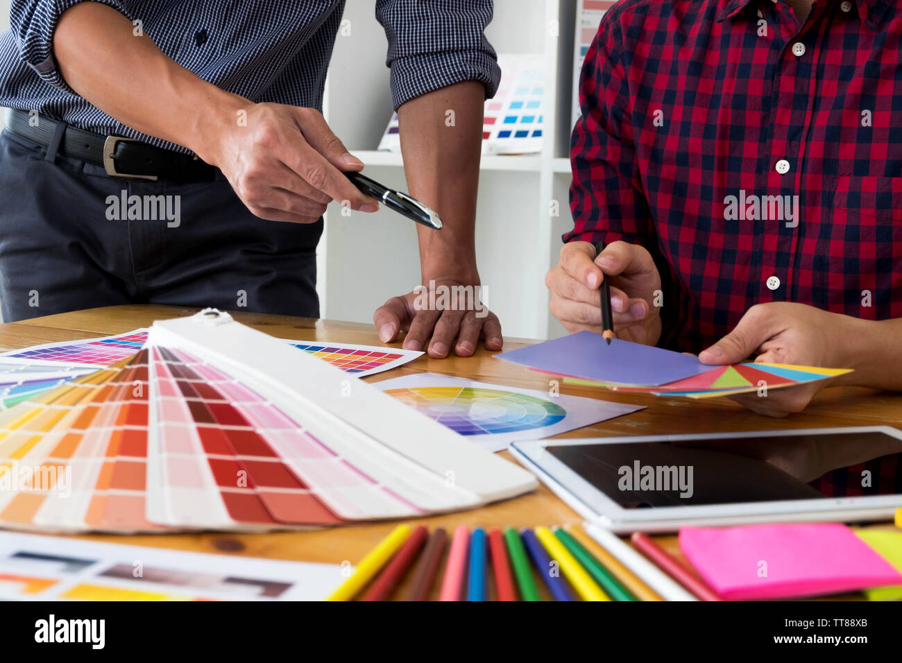 Graphic designers choose colors from the color bands samples for design ...