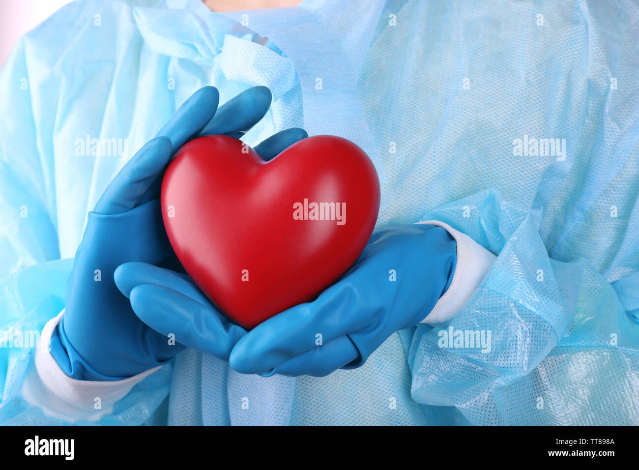 Decorative heart in doctors hands, close-up Stock Photo - Alamy