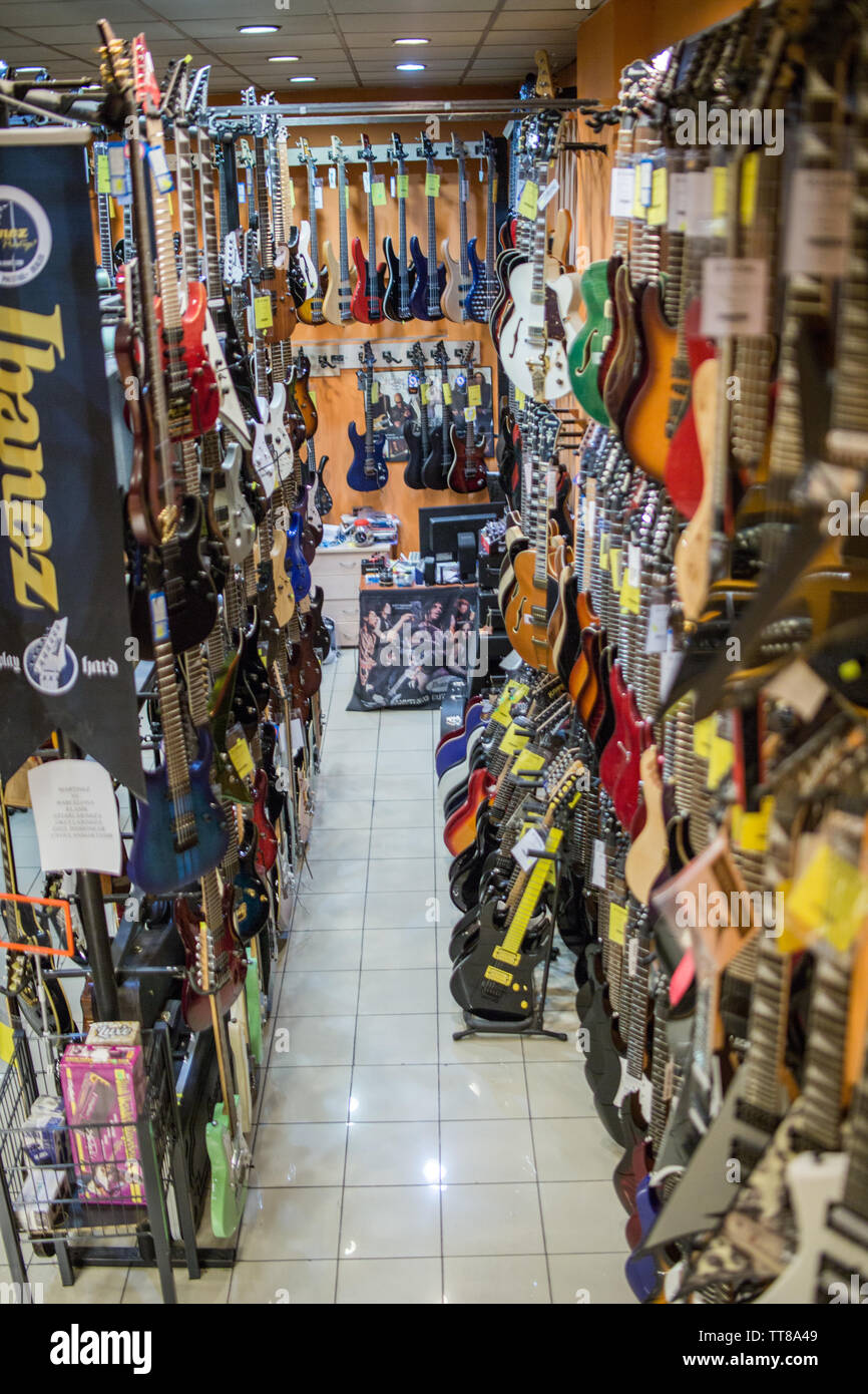 lots of electric guitars on sale at music store guitarists heaven Stock ...