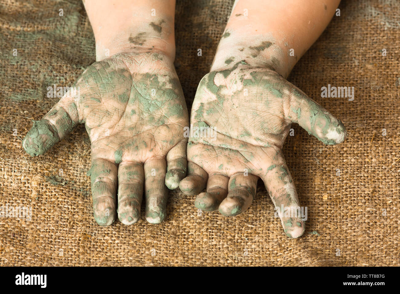 Child dirty hands mud hi-res stock photography and images - Alamy