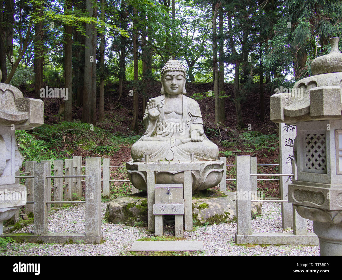 A stone Buddha statue in front of Shaka-do at Enryaku-ji Temple in Otsu ...