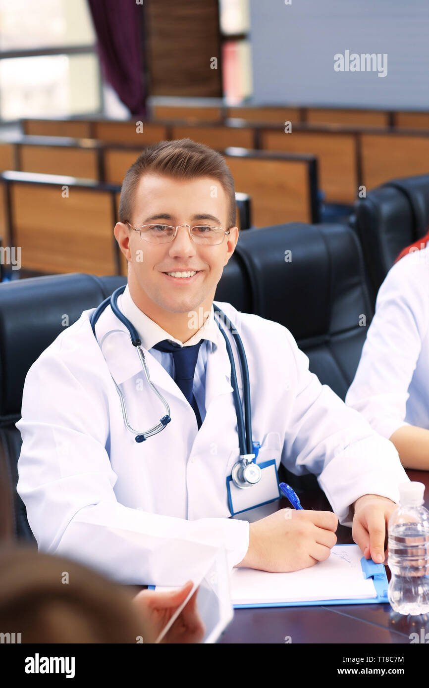 Attractive male doctor in conference room Stock Photo - Alamy