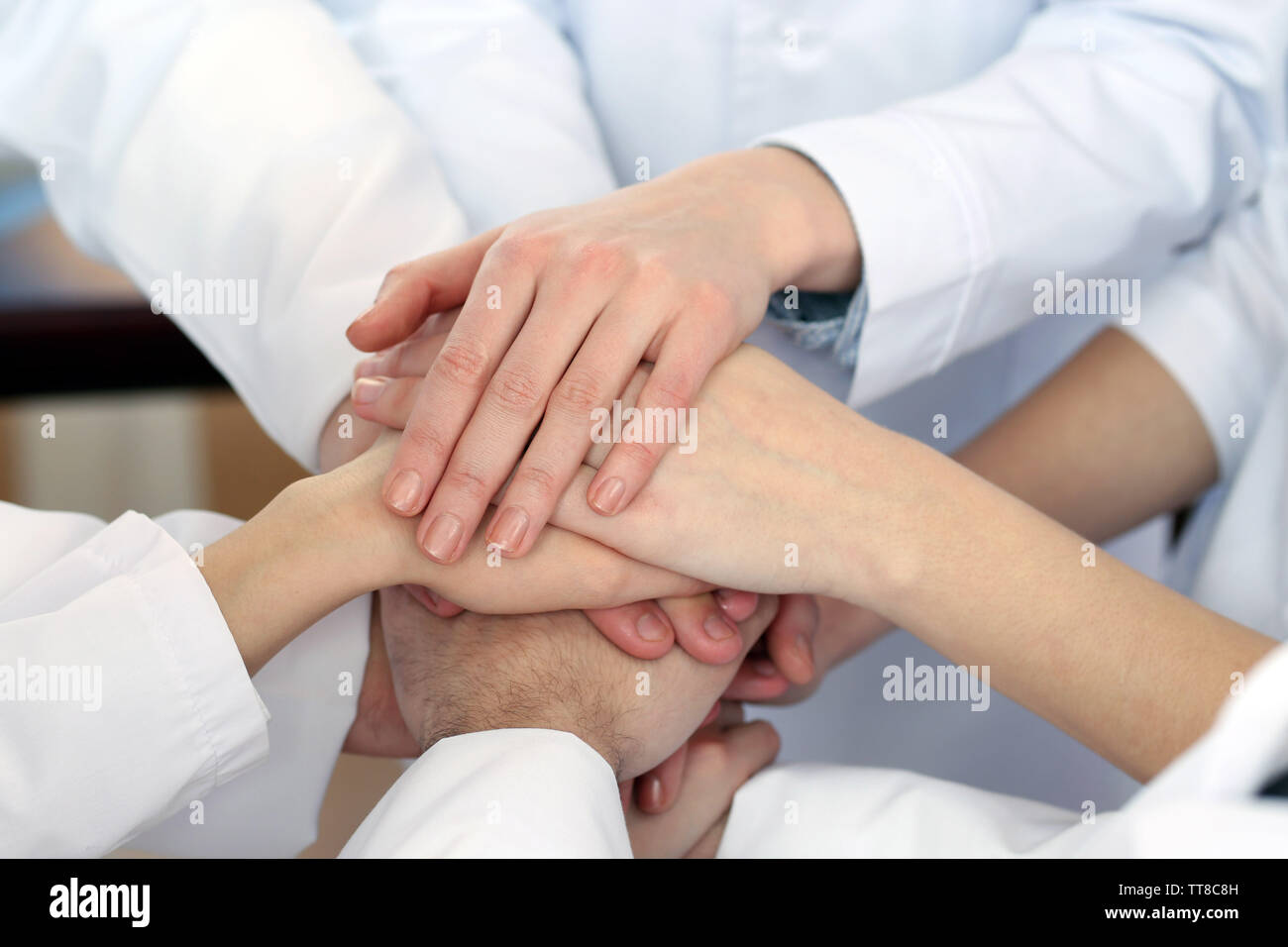 United hands of medical team close up Stock Photo - Alamy