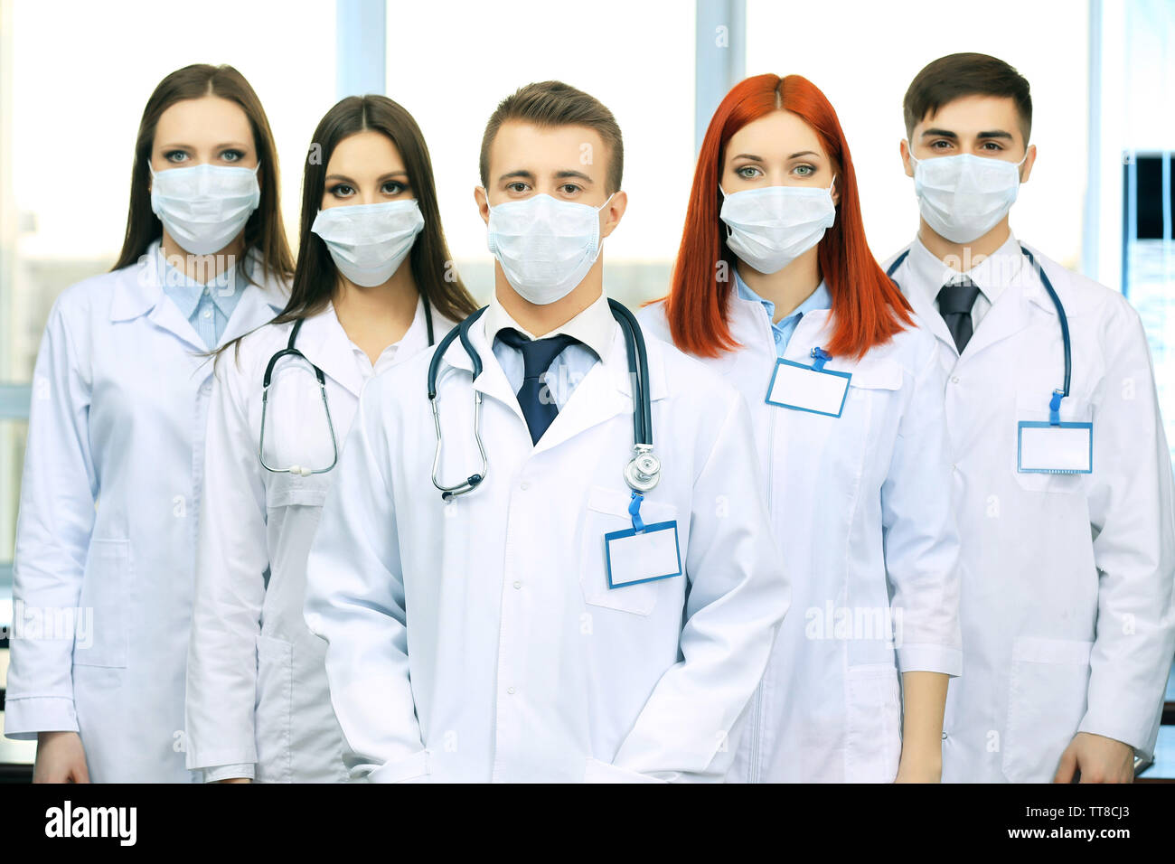 Medical workers in medical masks in conference room Stock Photo - Alamy