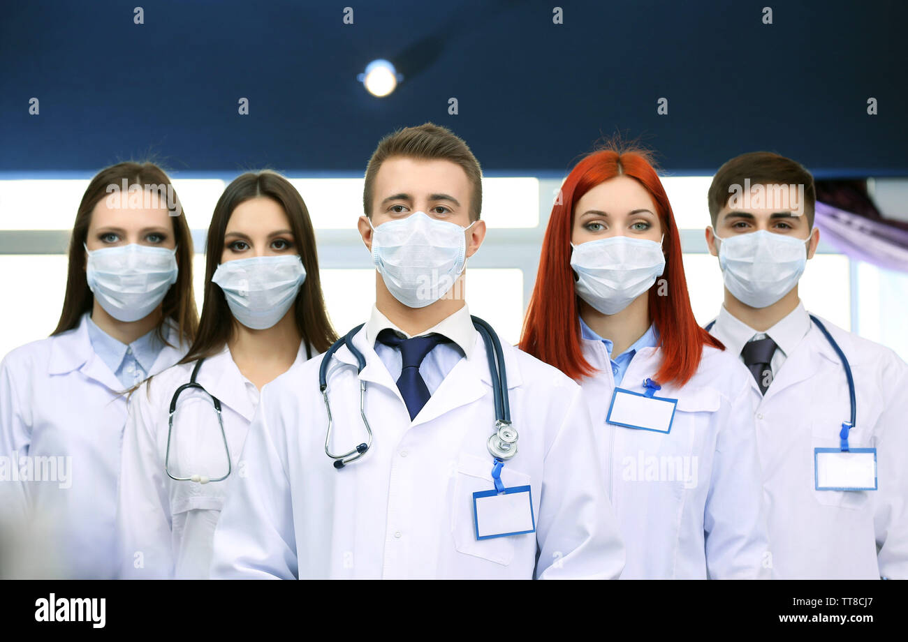Medical workers in medical masks in conference room Stock Photo - Alamy