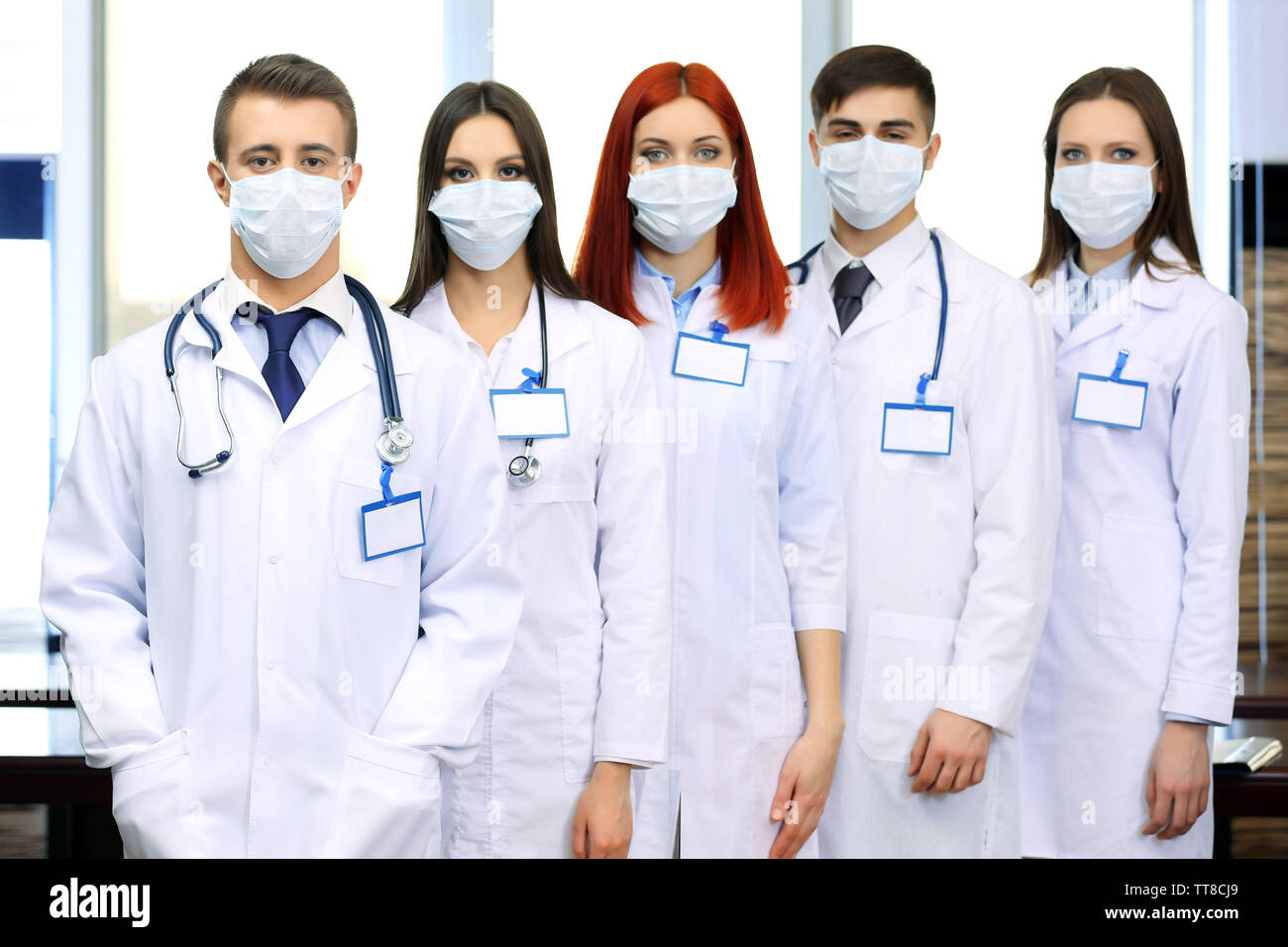 Medical workers in medical masks in conference room Stock Photo - Alamy