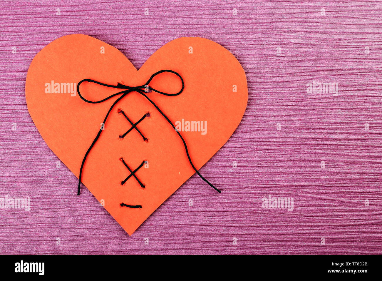 Stitched heart on colour background Stock Photo - Alamy