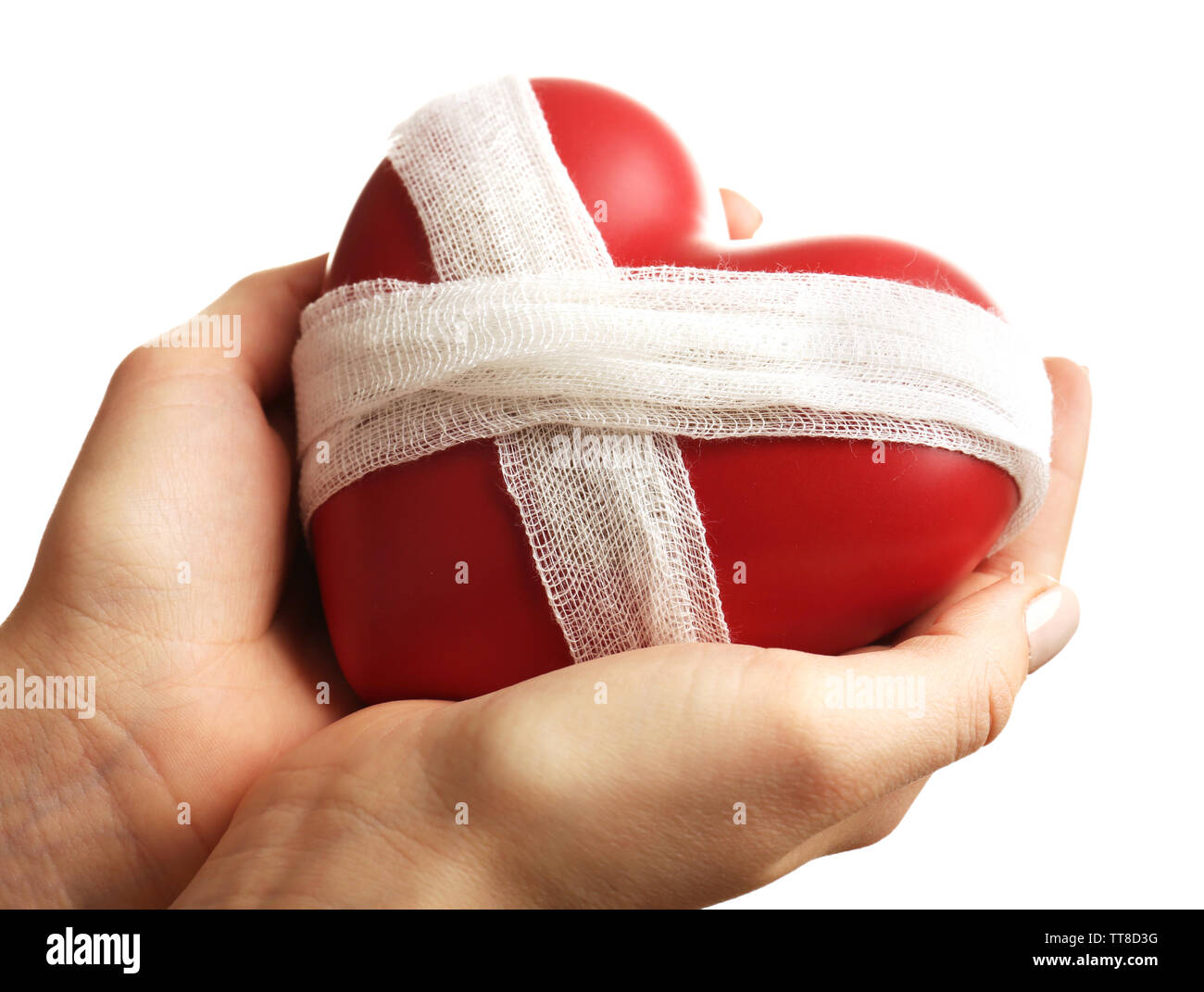 Female hands holding bandaged heart isolated on white Stock Photo - Alamy