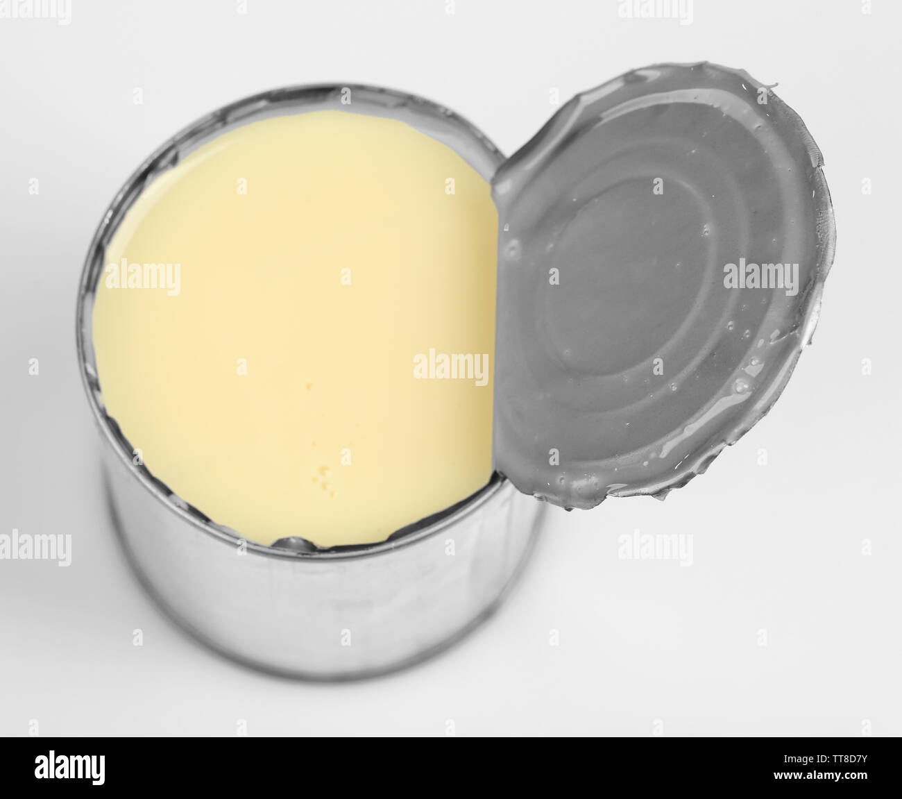 Tin can of condensed milk isolated on white Stock Photo - Alamy