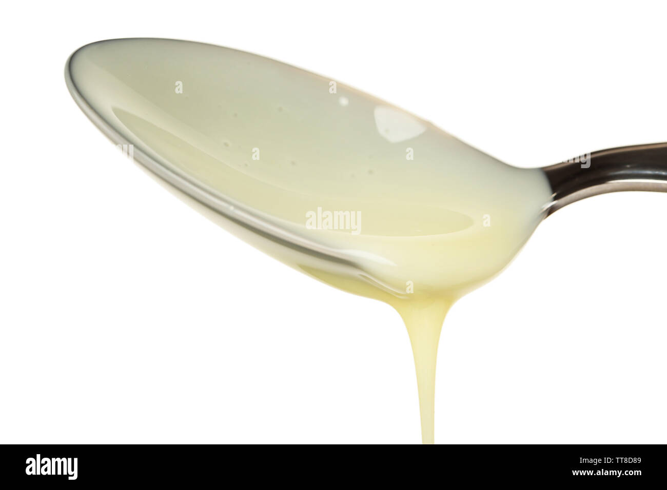 Condensed milk spoon on Cut Out Stock Images & Pictures - Alamy